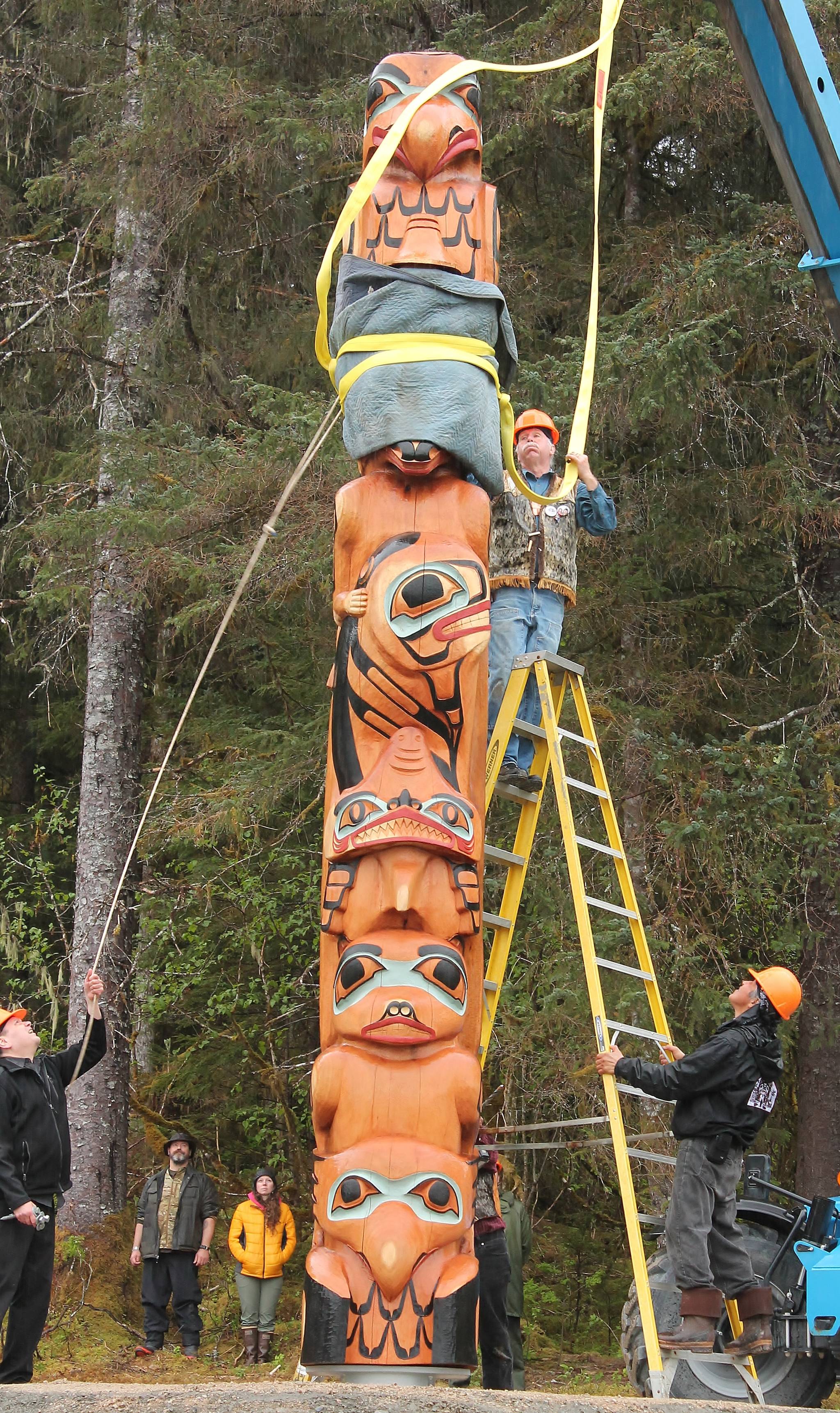 Two totem poles raised in front of Huna Ancestors’ House | Juneau Empire