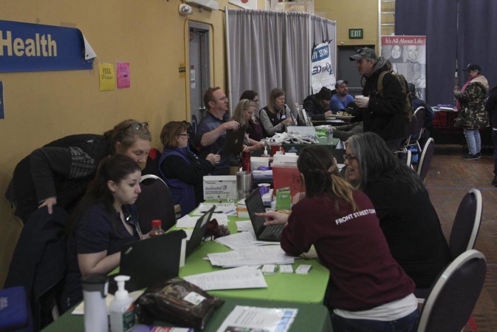 Hands-on care: Homeless receive haircuts, food, help at community event ...