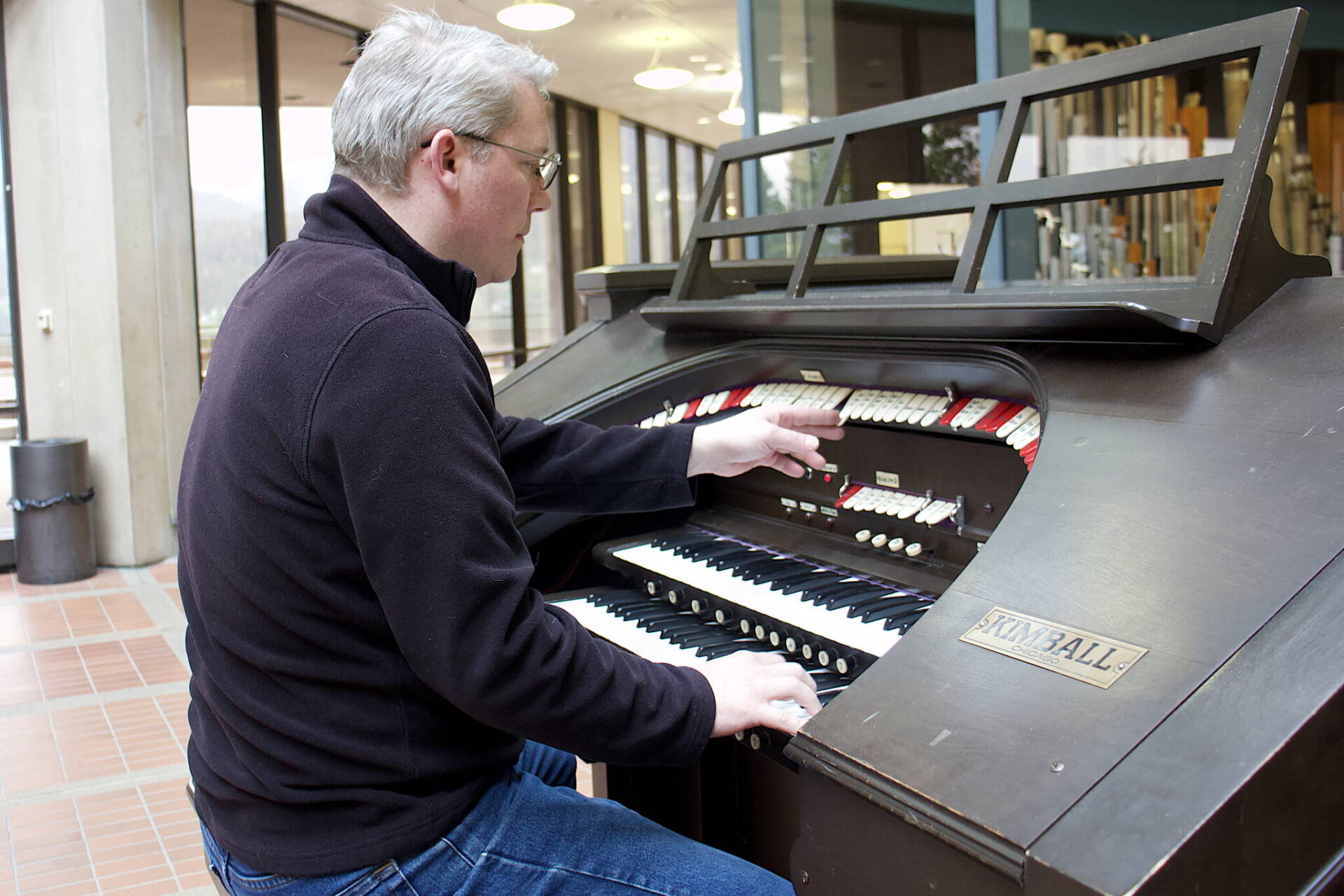 Clearing the old pipes in the Kimball organ at the State Office ...