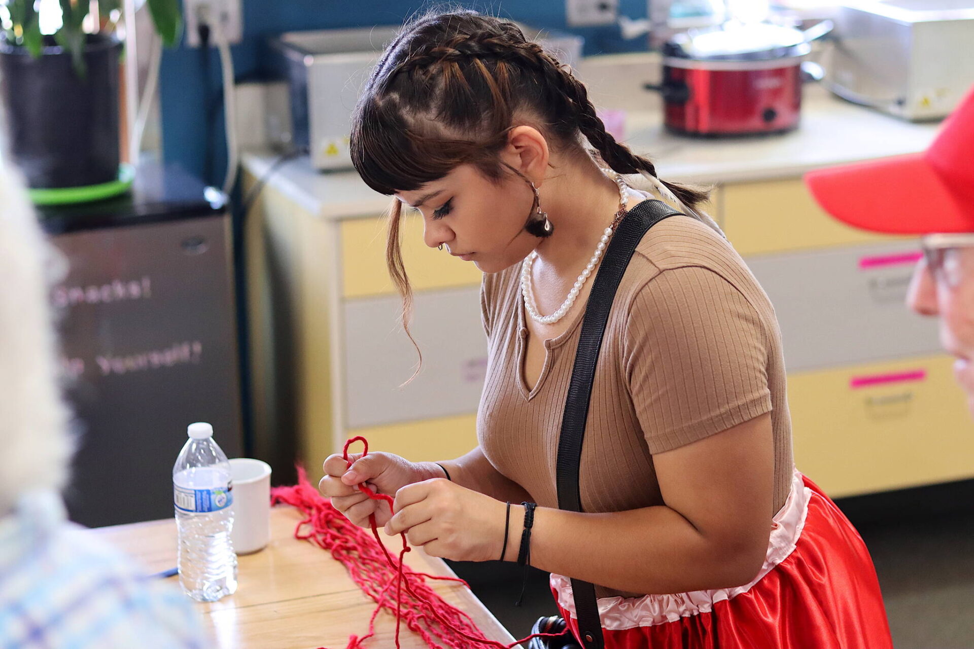 Spinning the first threads of two Alaska Native Pride Robes | Juneau Empire