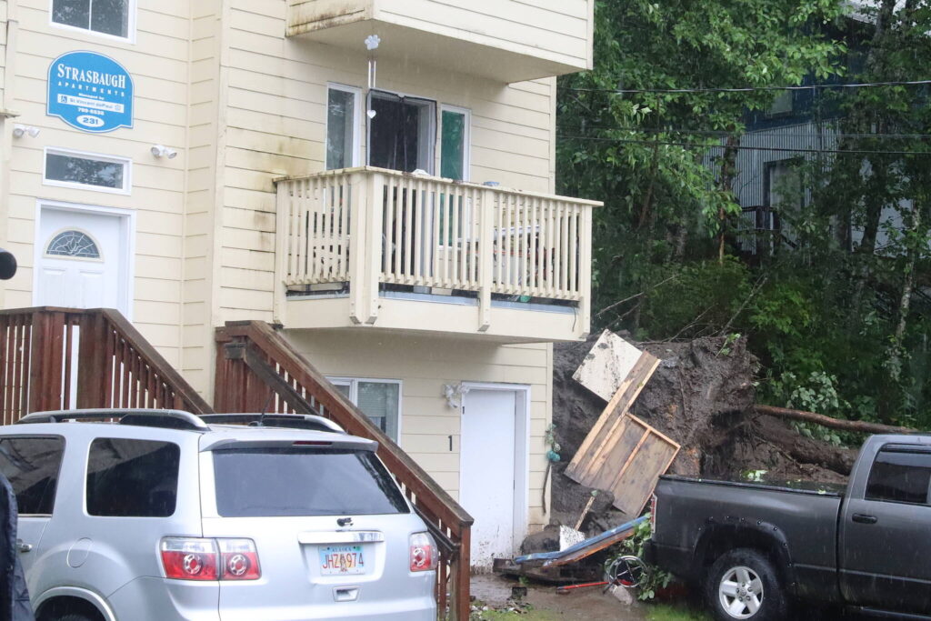 Landslide triggered by heavy rain damages apartment building on ...