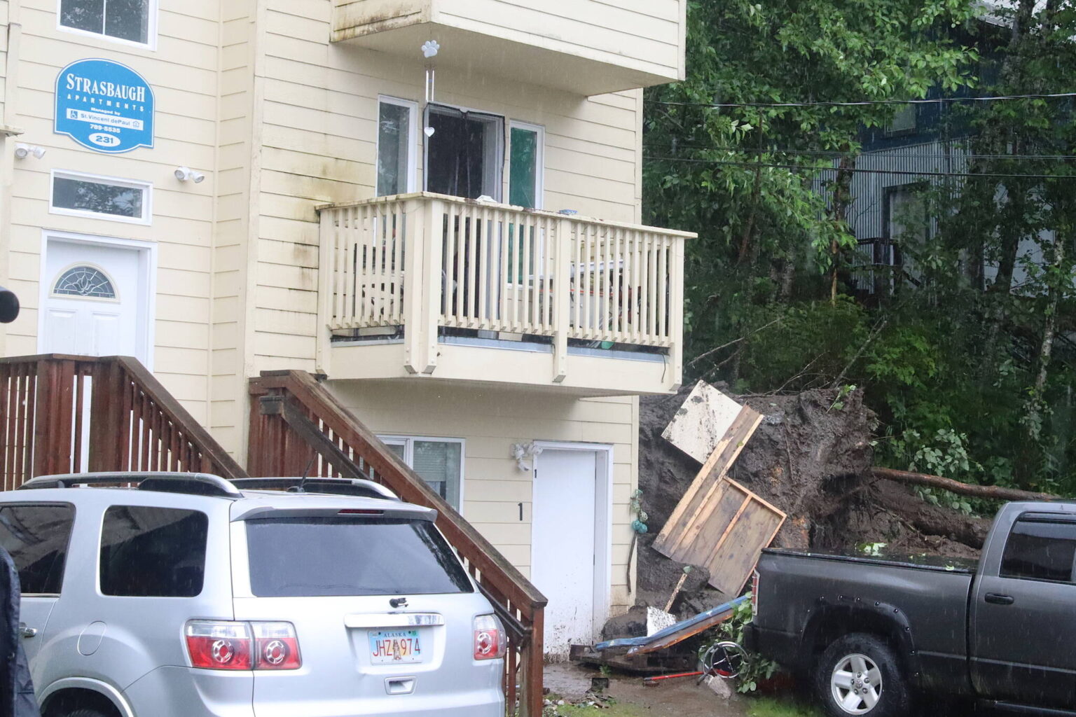 Landslide triggered by heavy rain damages apartment building on ...